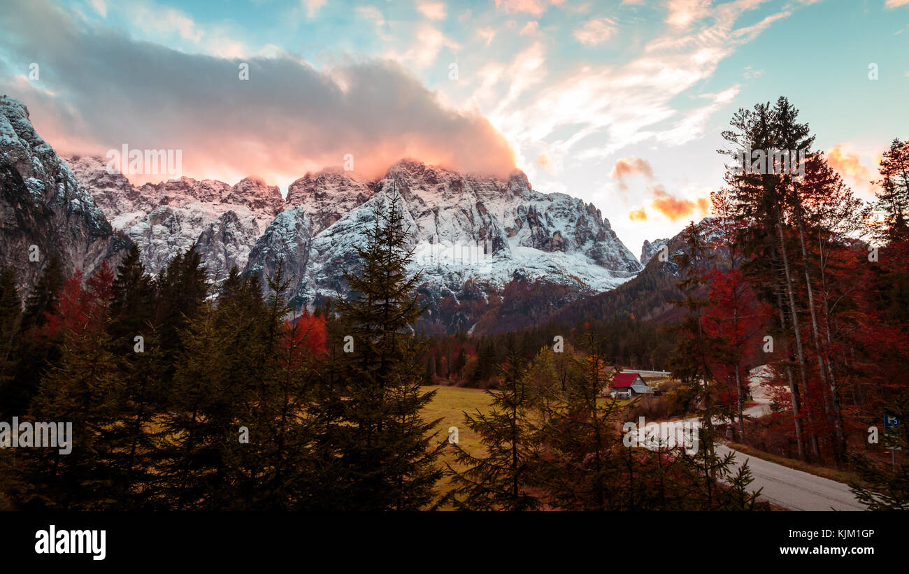 an alpine hut in the valley during a colorful sunset Stock Photo - Alamy