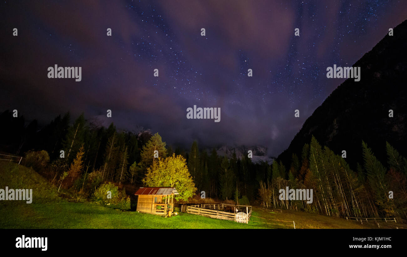 an alpine hut in the valley during a dark night Stock Photo - Alamy