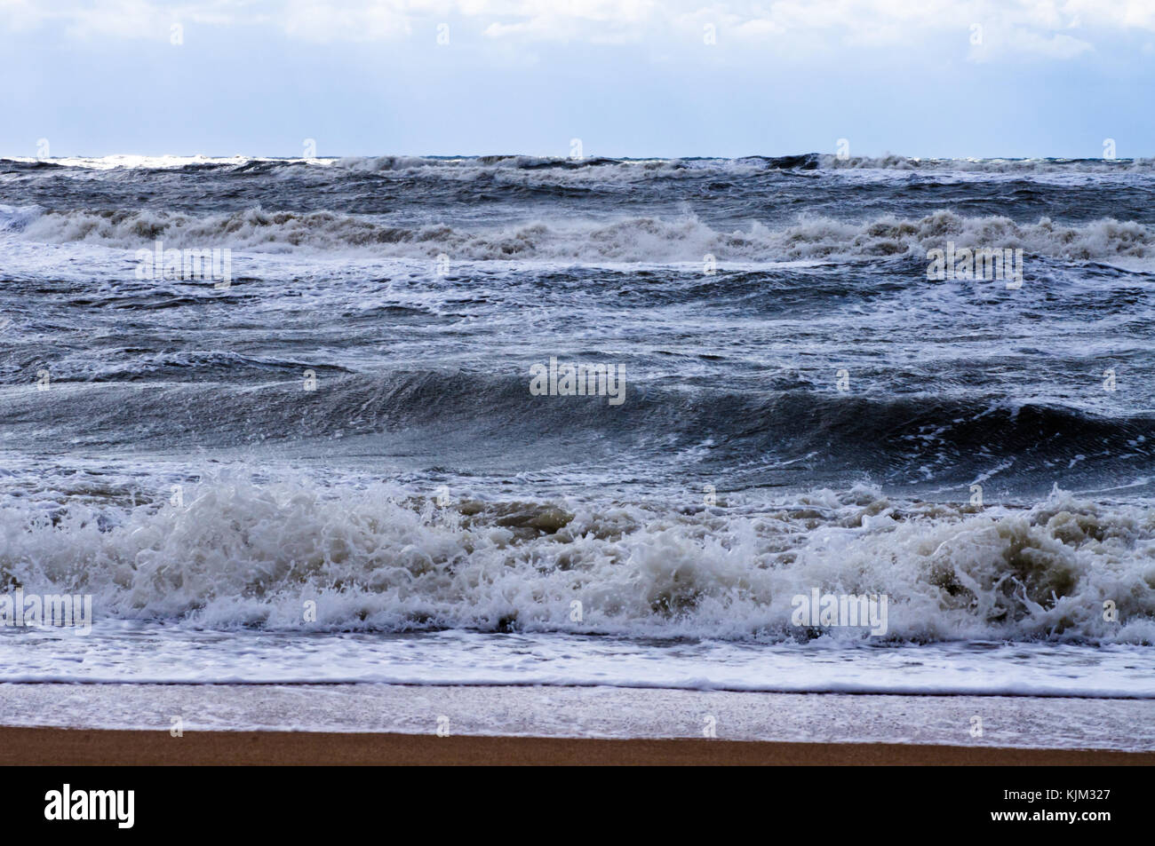 Sea storm in the shade of a cloud in the distance sunlight Stock Photo ...