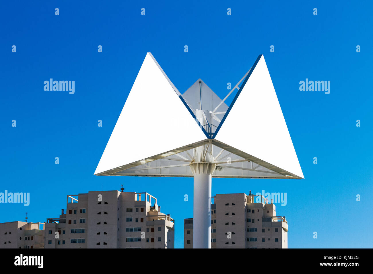 Mock up. Triangle billboard or advertising poster with city and blue ...