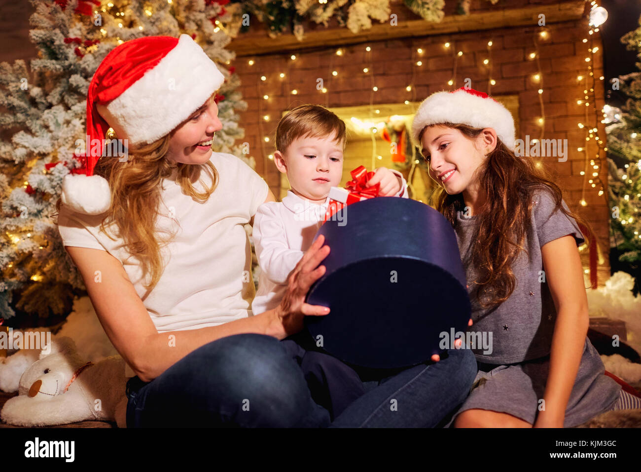 The family gives presents in a room on Christmas Day Stock Photo - Alamy
