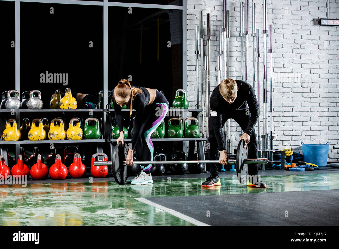 the young girl is getting ready for the exercise with the trainer Stock ...