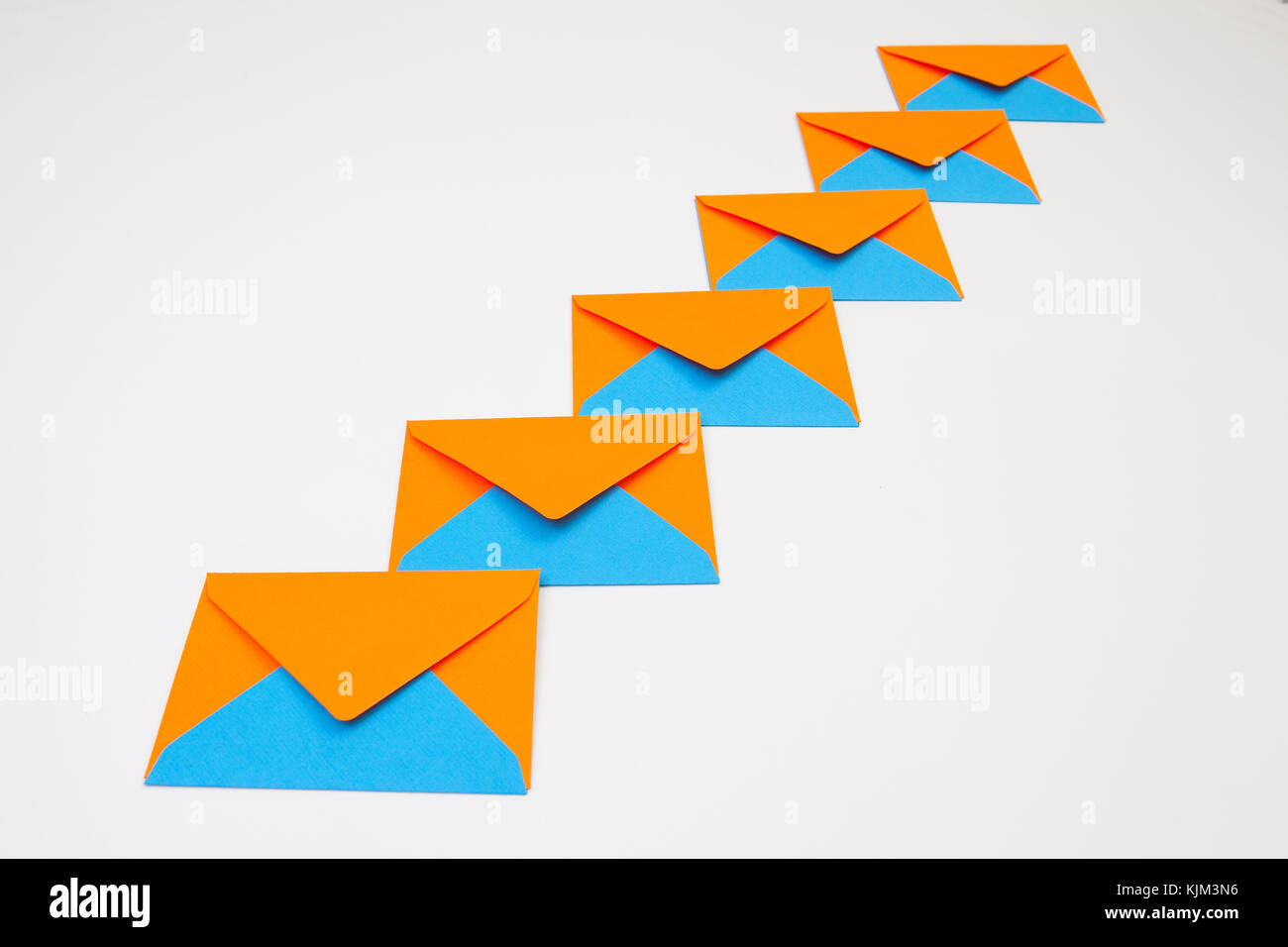 Different colored envelopes on the table Stock Photo - Alamy