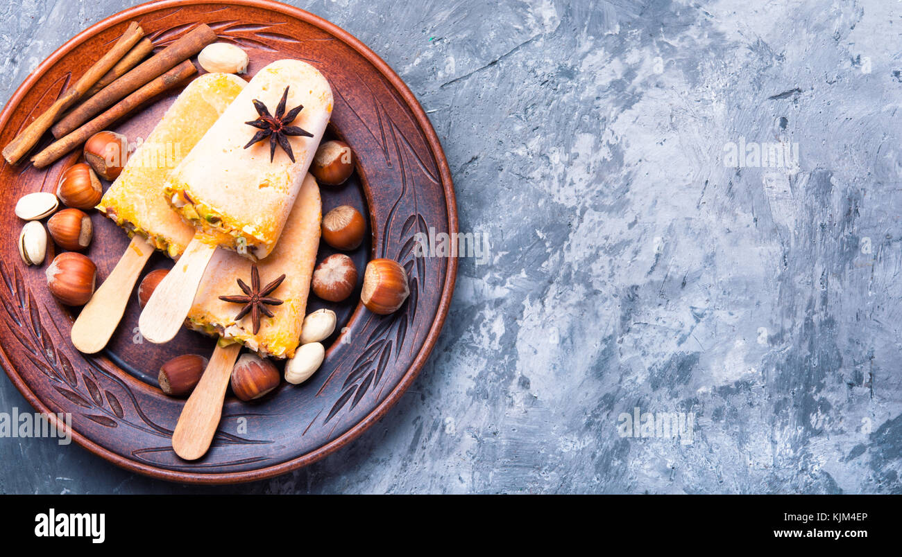 Summer ice cream with nutty taste on a stylish dish Stock Photo - Alamy