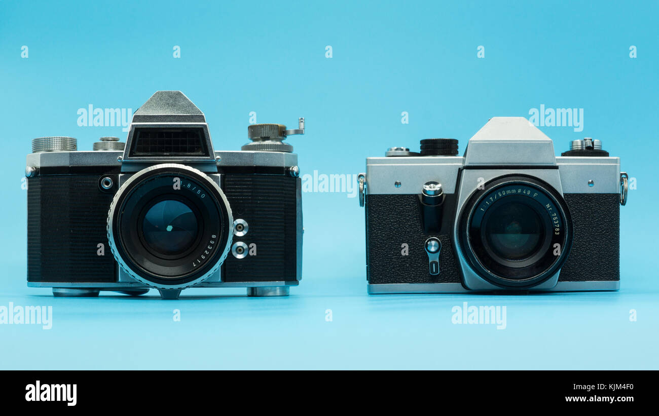 Analog Cameras with blue Background Stock Photo - Alamy