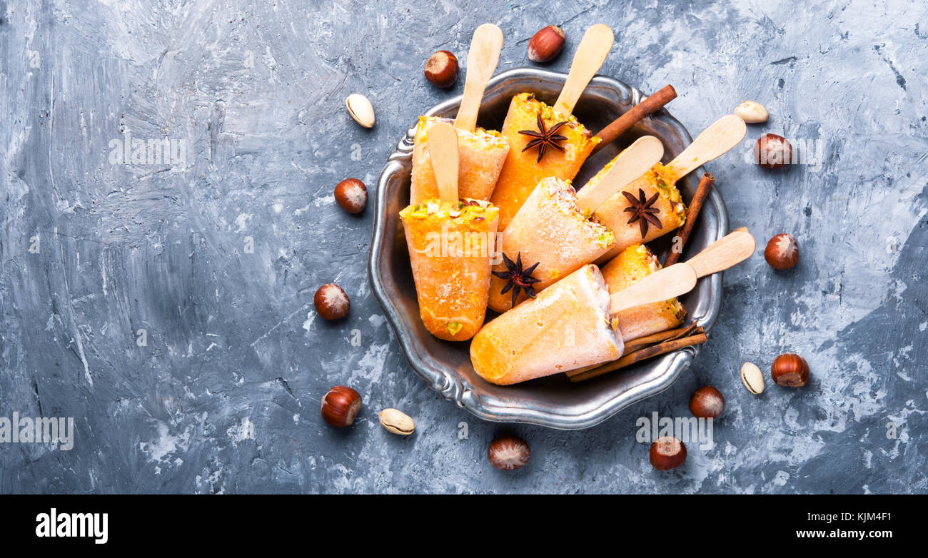 Summer ice cream with nutty taste on a stylish dish Stock Photo - Alamy