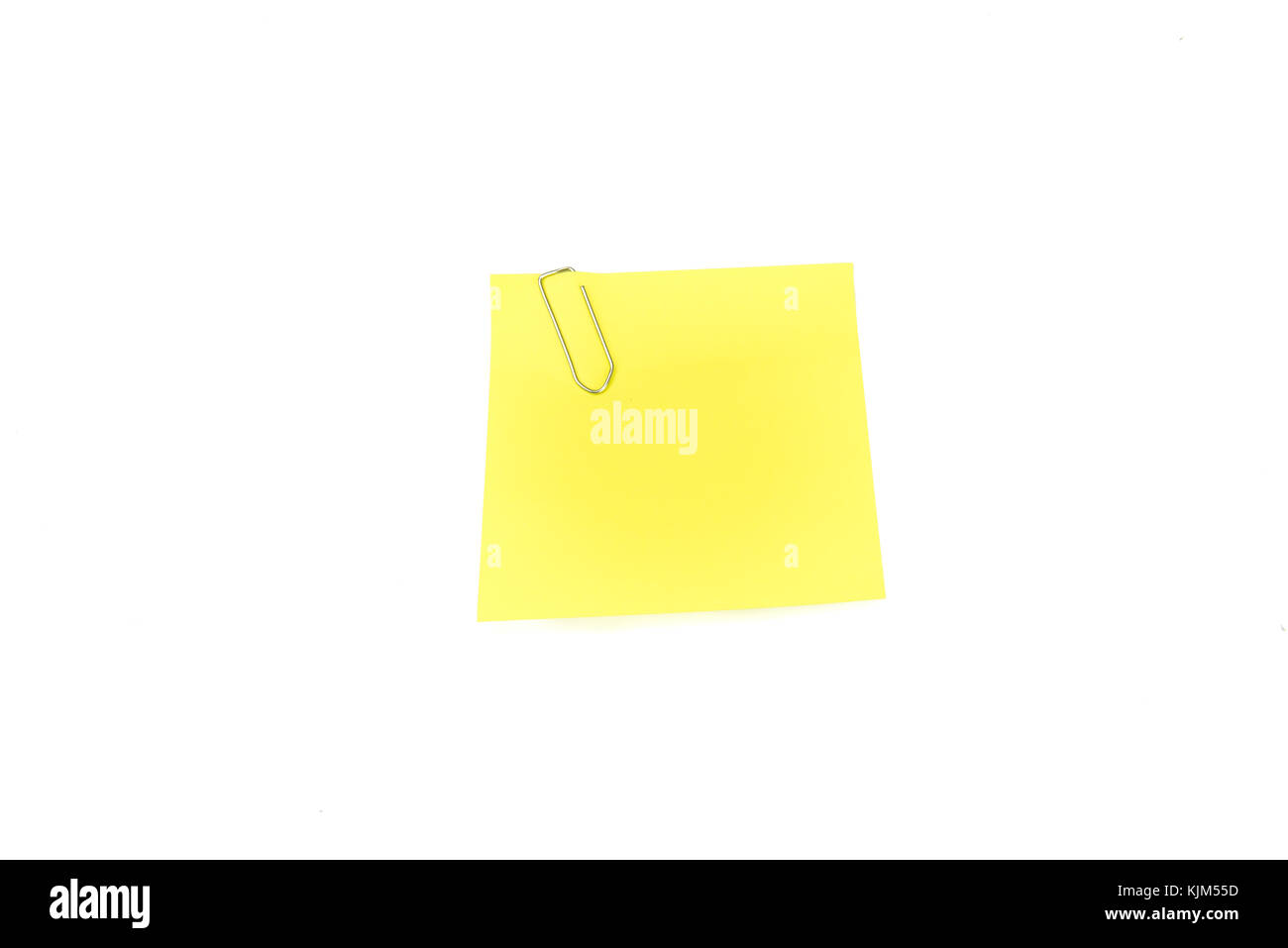 Yellow post it notes with paperclip Stock Photo - Alamy