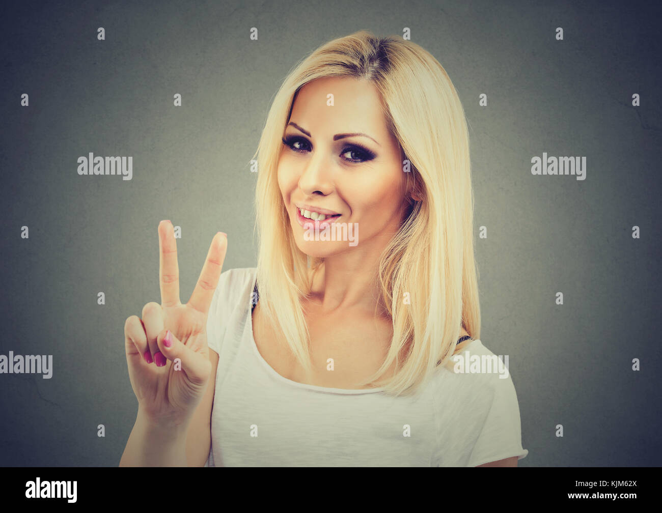 Woman hand victory sign hi-res stock photography and images - Alamy
