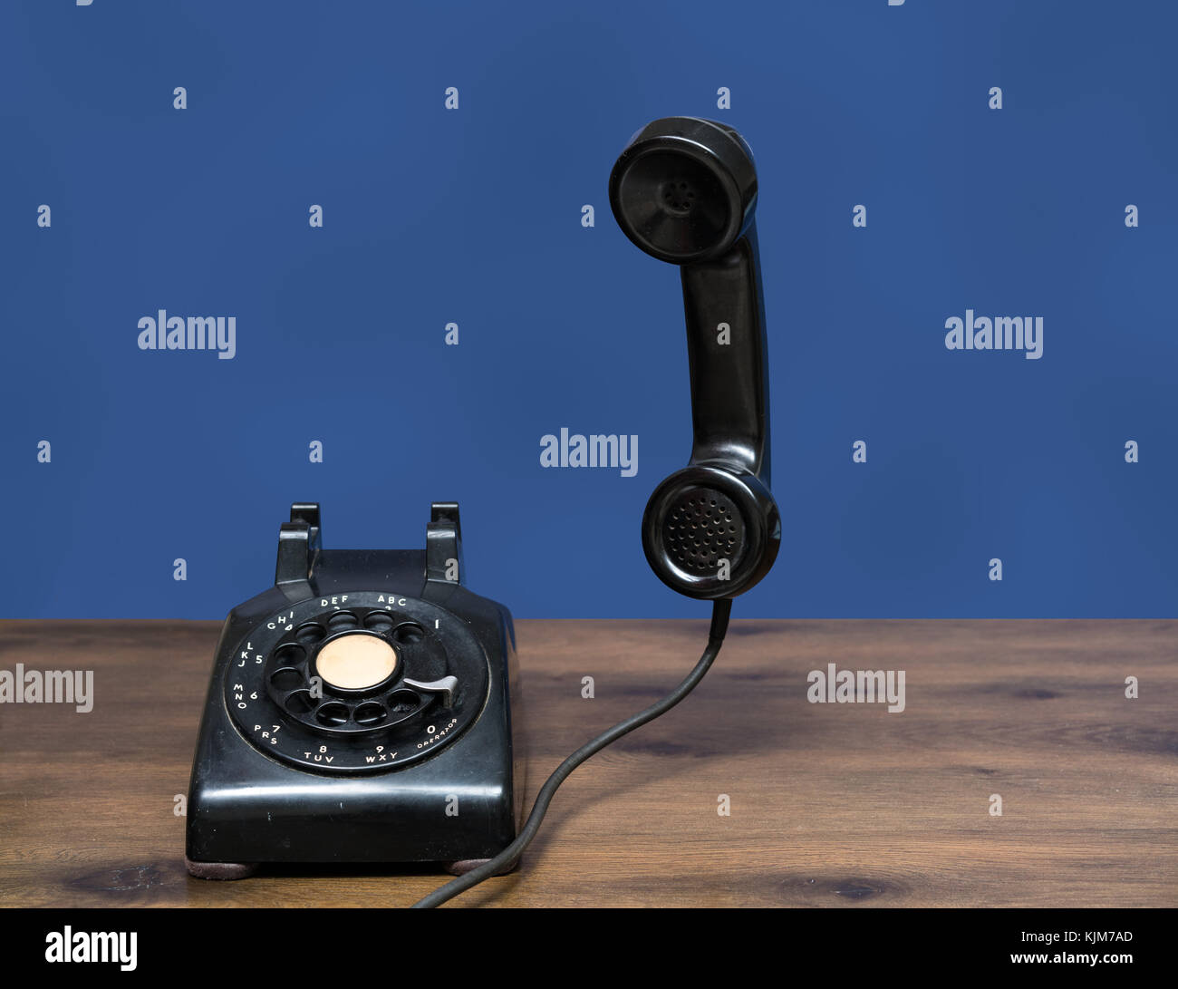 Antique old rotary dial telephone on wooden desk Stock Photo - Alamy