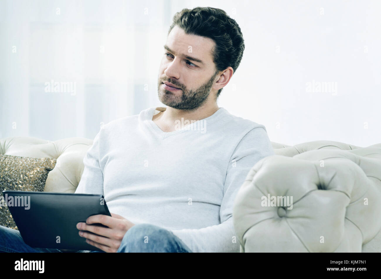 Handsome nice man resting at home Stock Photo - Alamy