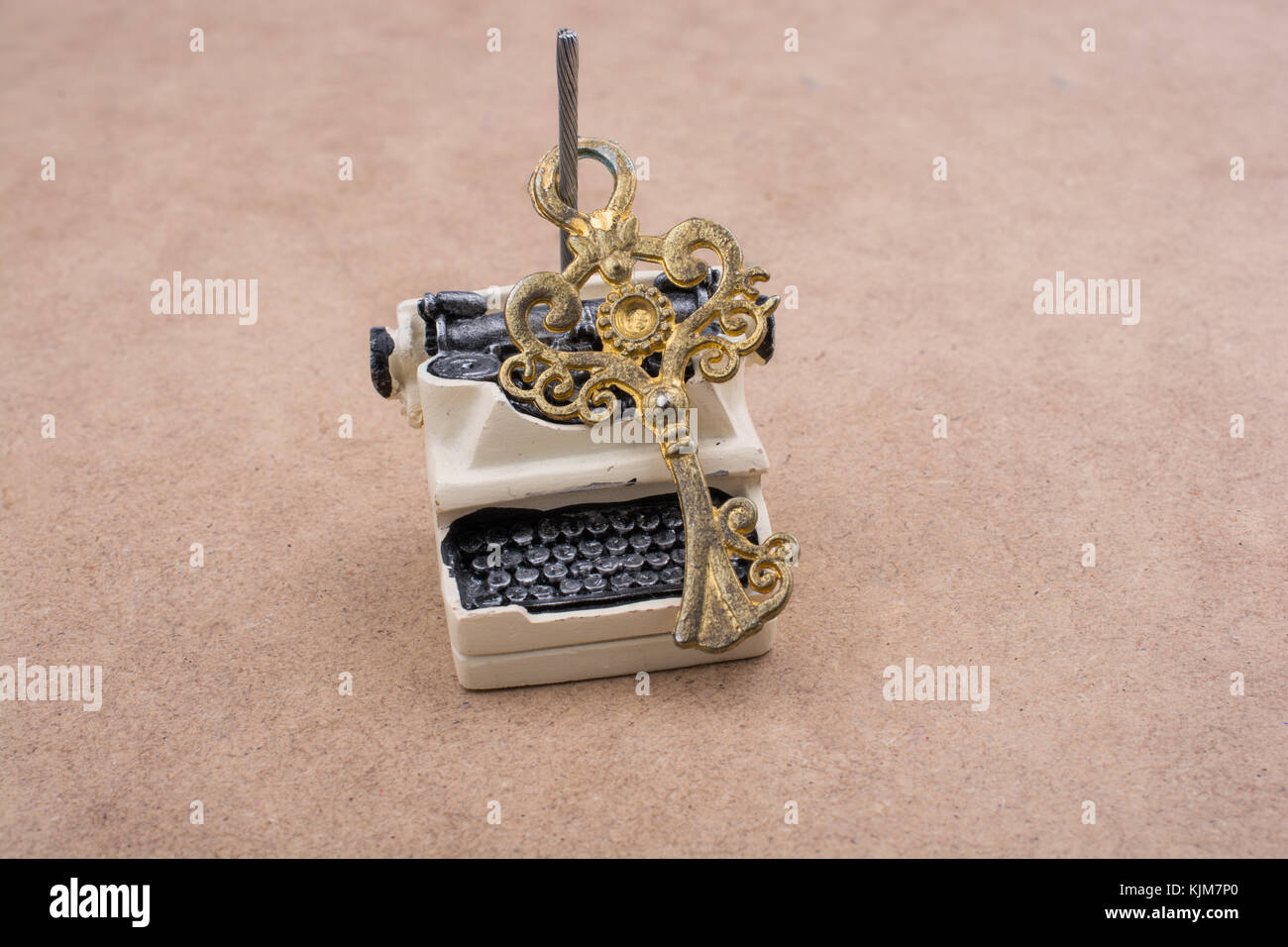 Retro syled tiny typewriter model on a white background Stock Photo - Alamy