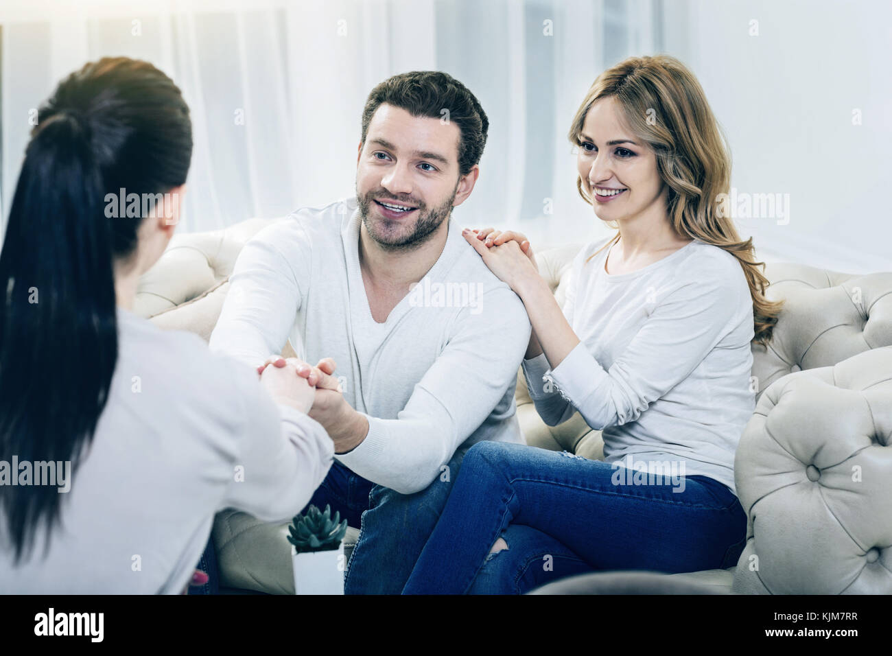 Joyful delighted man expressing his gratitude Stock Photo - Alamy