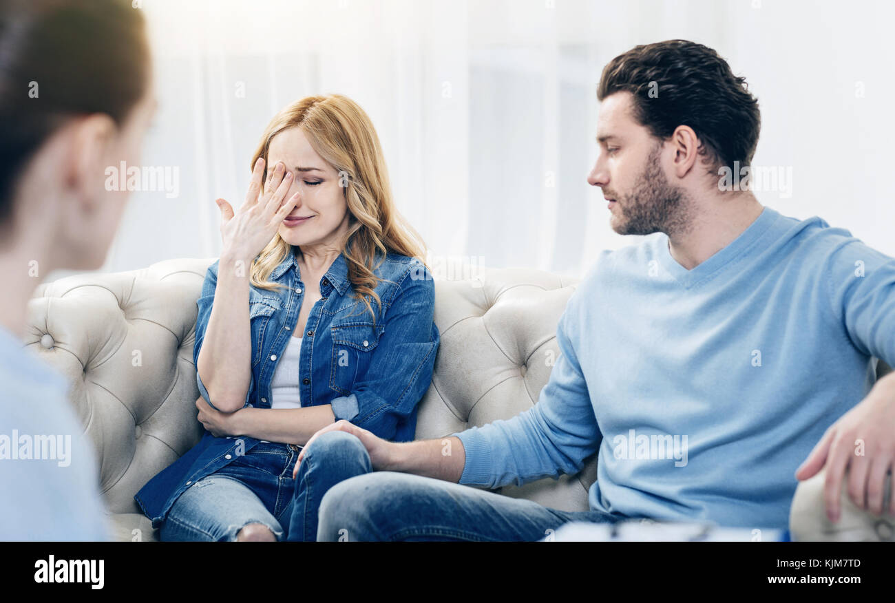 Cheerless upset woman crying Stock Photo - Alamy