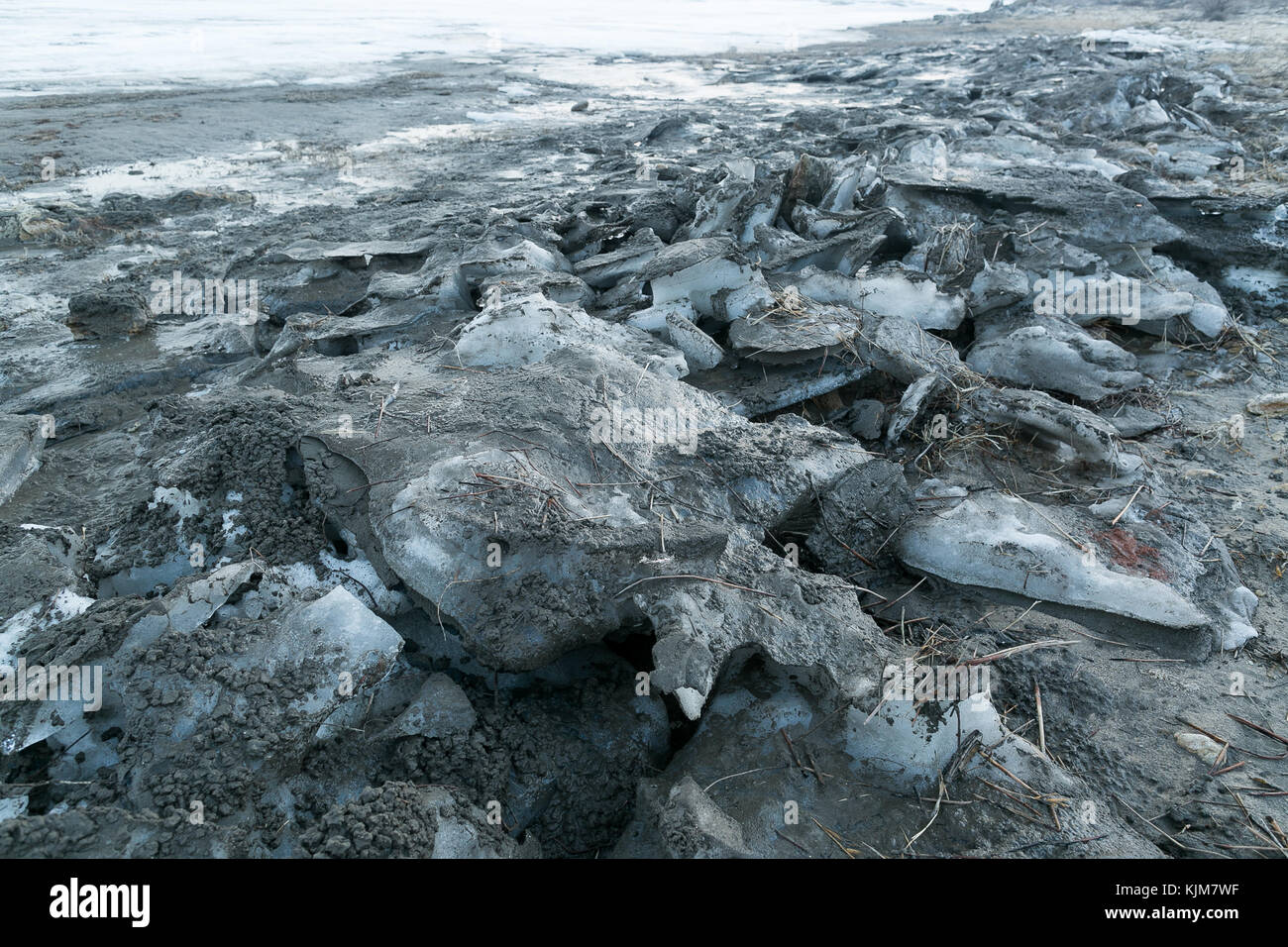 winter, nature, water resours concept. there are grey dirty blocks of ...
