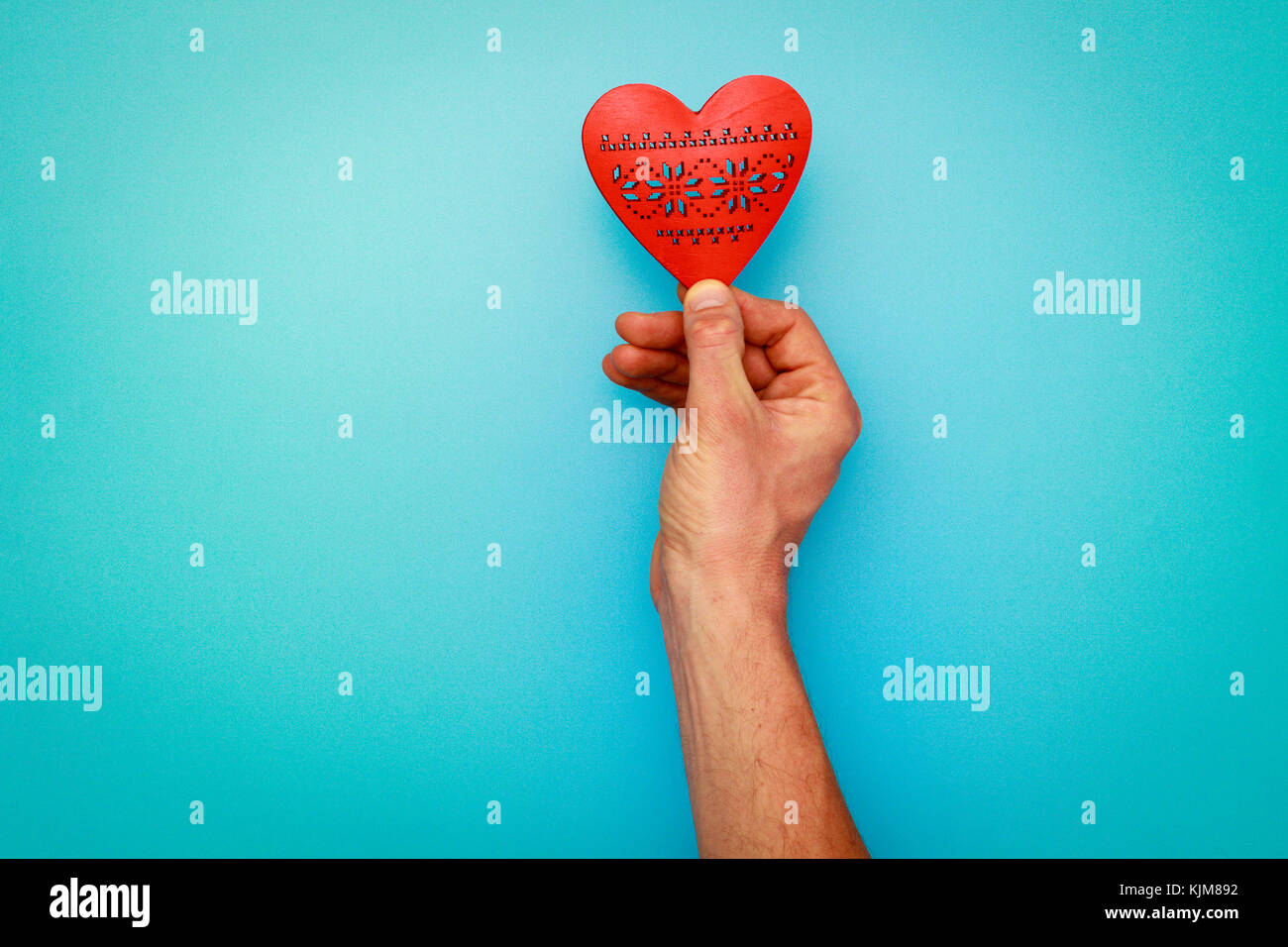 The men's hand hold red heart, view from above. Concept of Valentine or ...