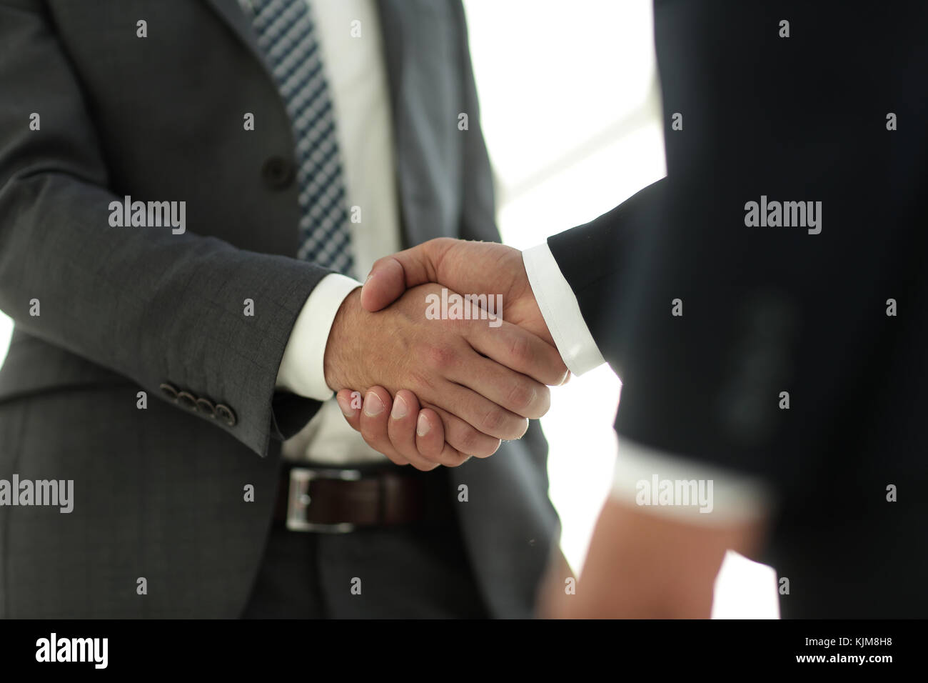 Businessman giving his hand for handshake to partner Stock Photo - Alamy