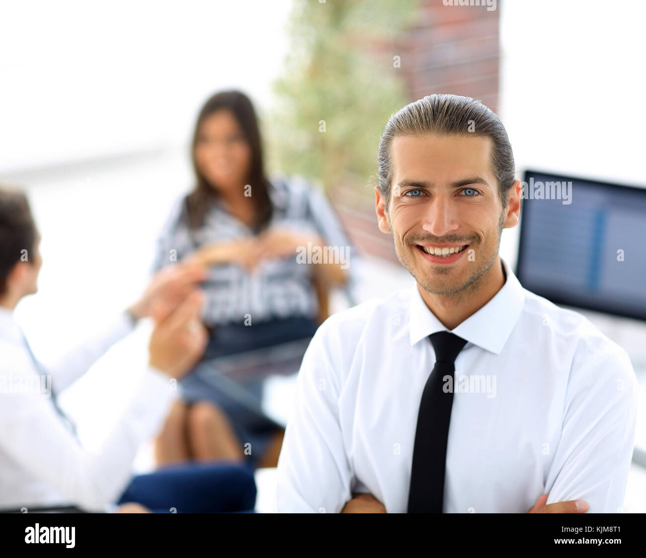 successful young business men on blurred background Stock Photo - Alamy
