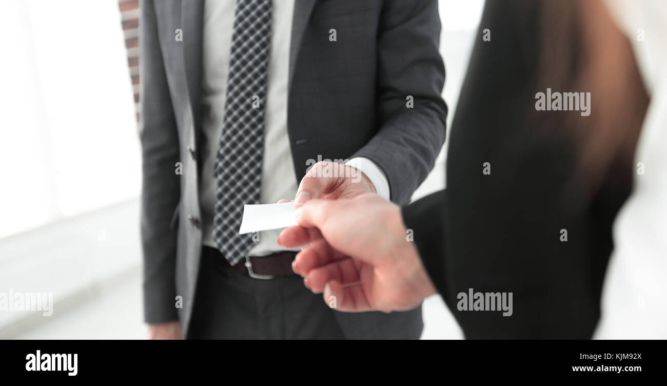 Exchange business card for first time meet Stock Photo - Alamy
