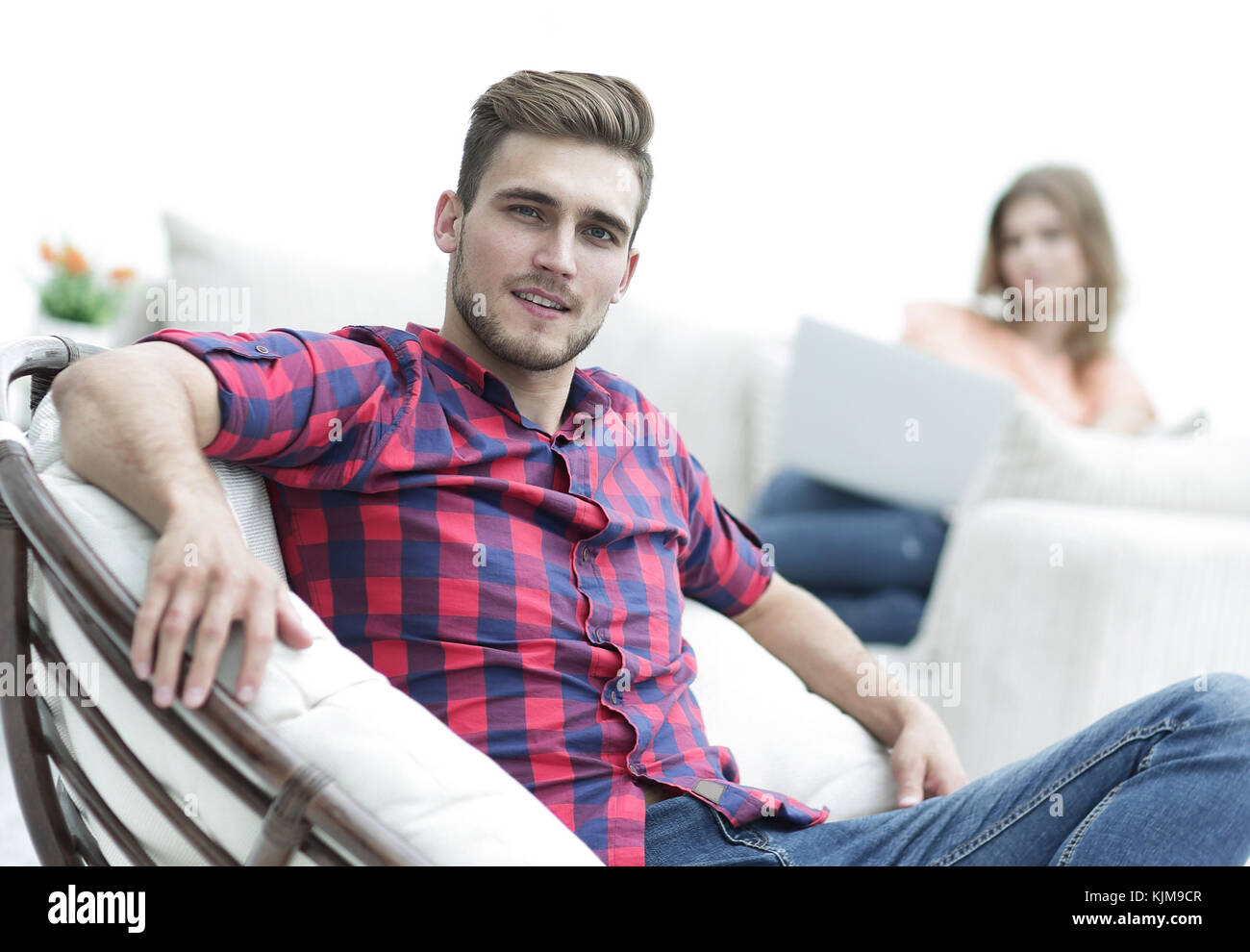 young man sitting in the big chair Stock Photo - Alamy