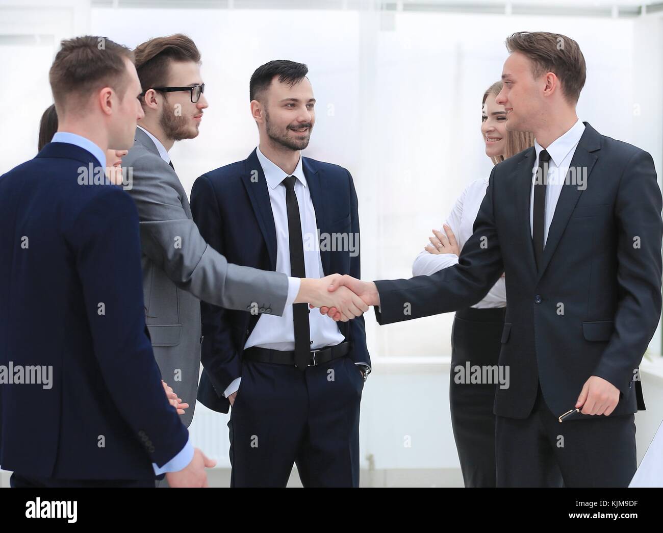 handshake Manager and the client in the office Stock Photo - Alamy