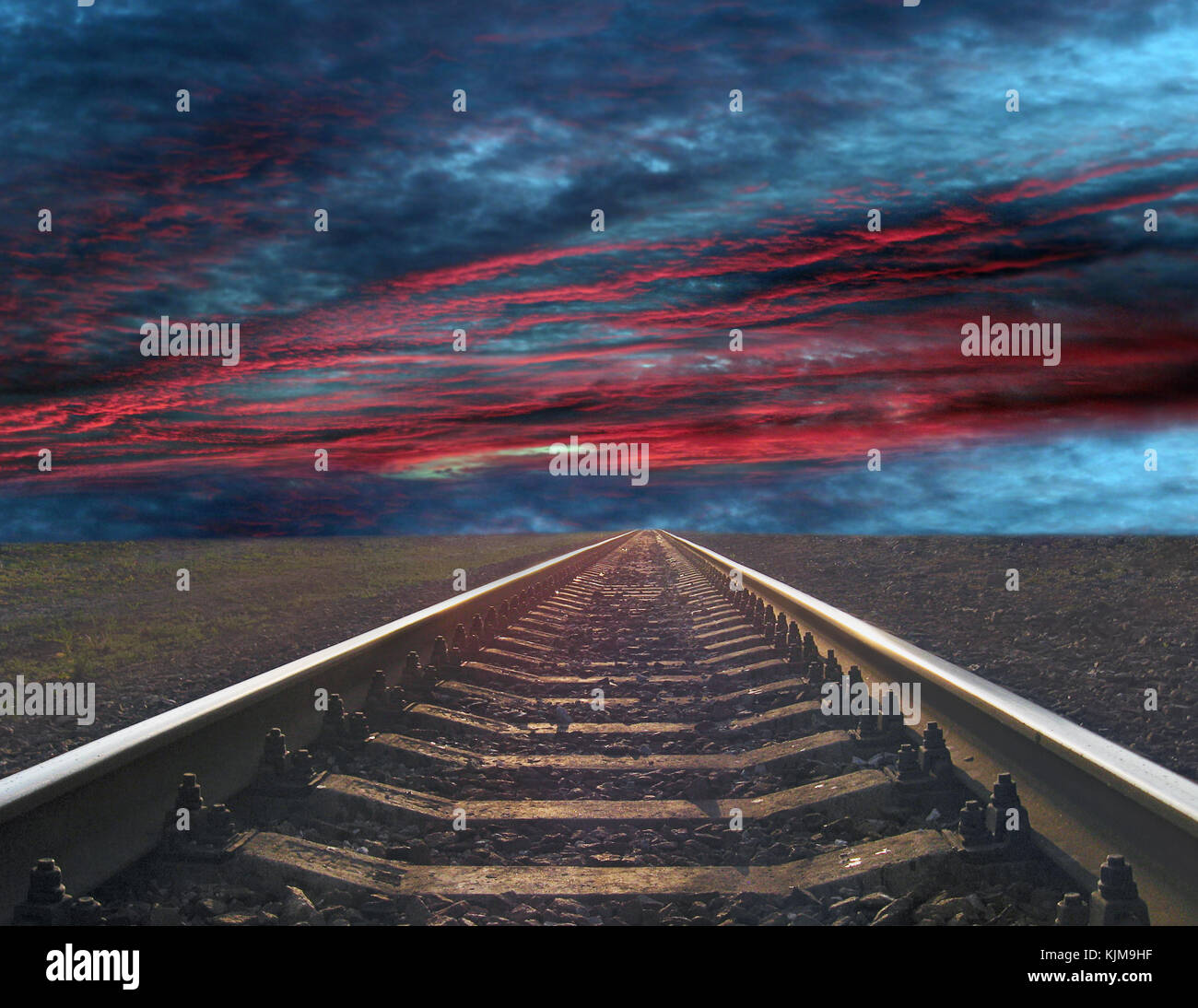 rails going away into the gloomy landscape. Black and white image with ...