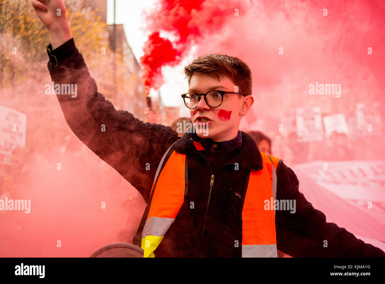 Student with red smoke flare at the protest demo for the Campaign ...