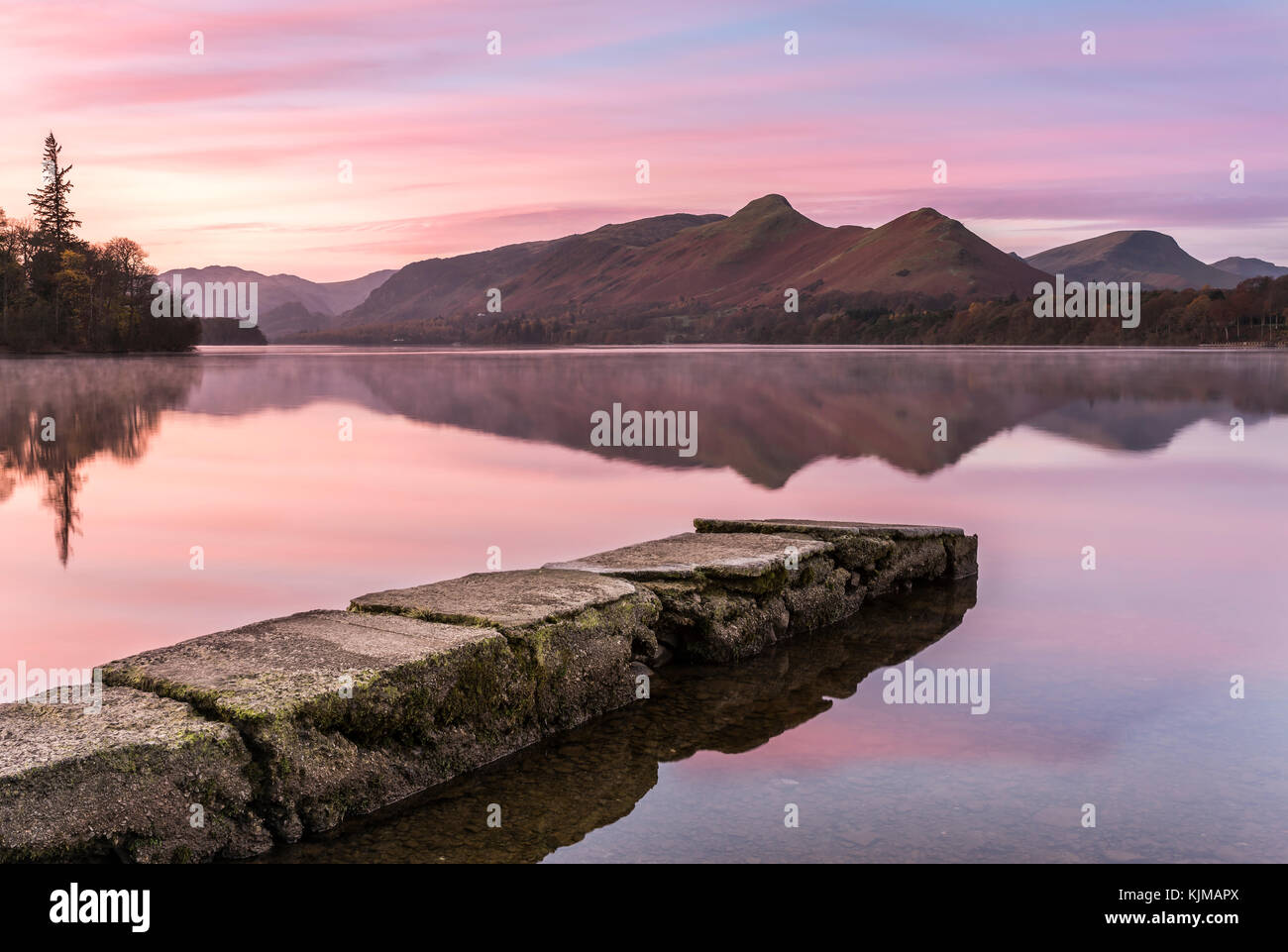 Old stone jetty at Isthmus Bay on a still frosty morning Stock Photo ...