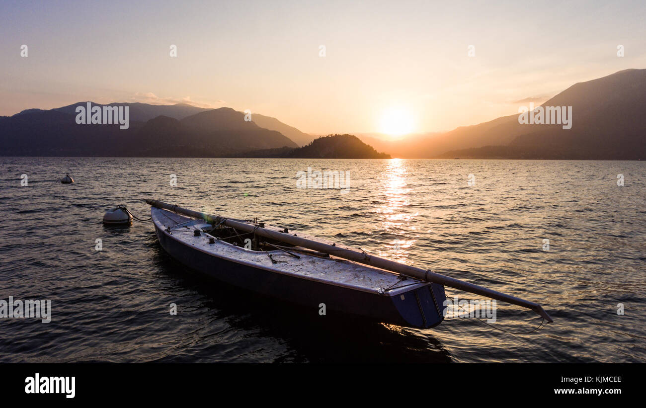 Sunset, boat on the lake Stock Photo - Alamy