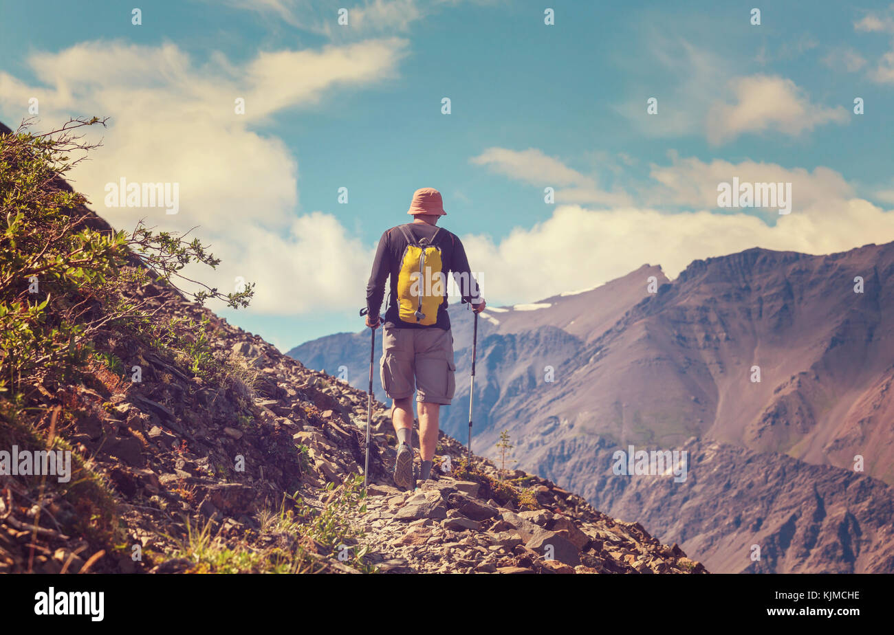 Hiking man in the mountains Stock Photo - Alamy