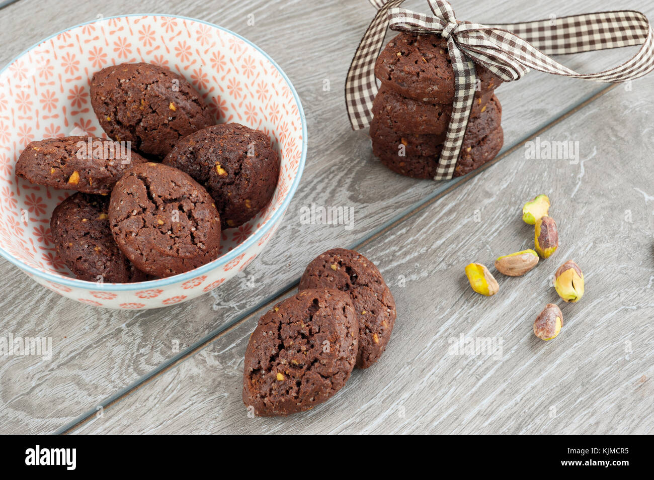 RUSTIC COOKIES COCOA STACKED AND PISTACHIOS Stock Photo - Alamy