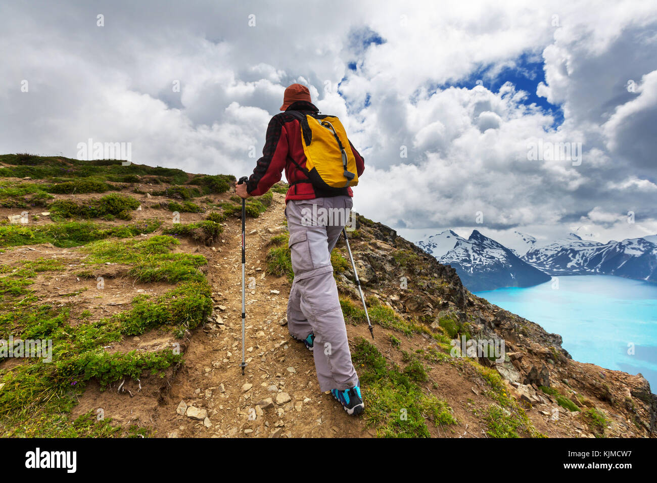 Hiking man in the mountains Stock Photo - Alamy
