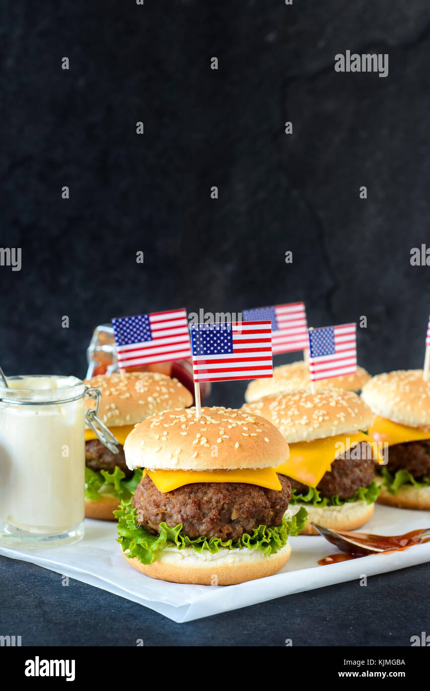 American mini beef burgers with cheese and USA flags,selective focus ...