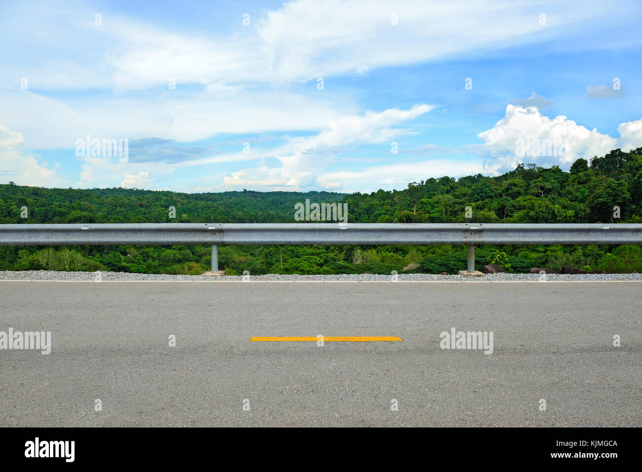 Roadside view and clouds on blue sky Stock Photo - Alamy