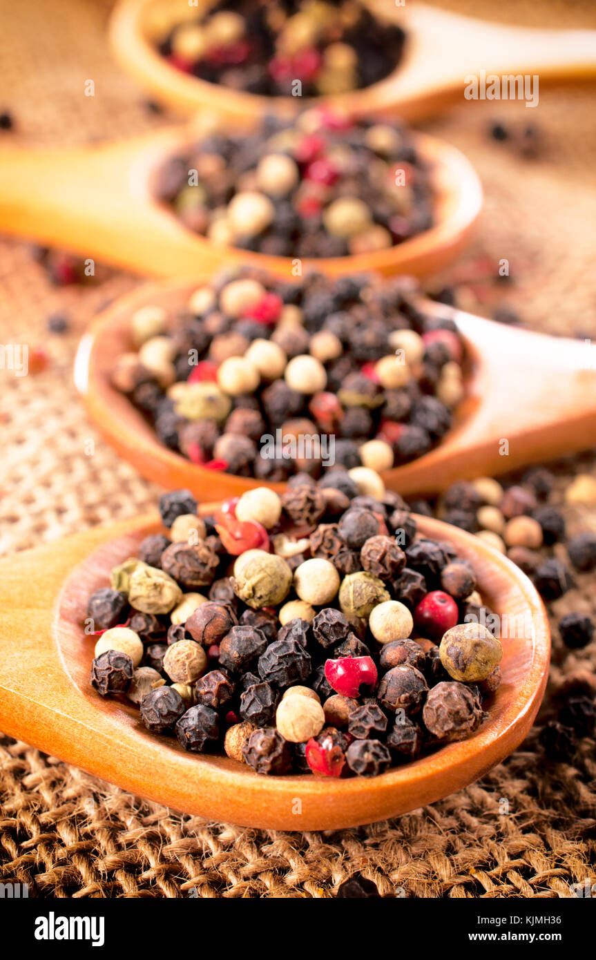 Close up to pepper spice mix in wooden spoon Stock Photo - Alamy