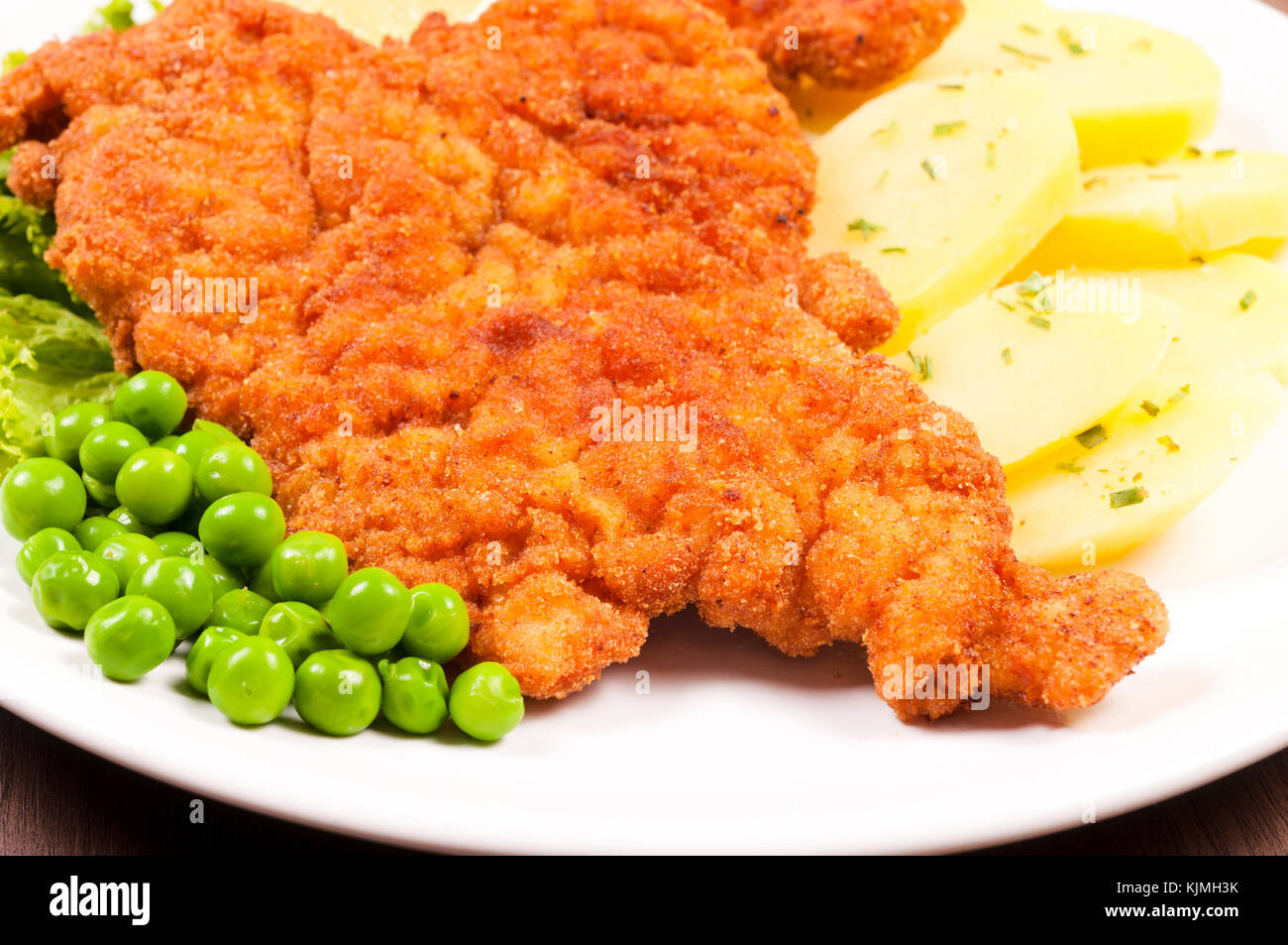 Closeup to a wiener schnitzel on plate Stock Photo - Alamy