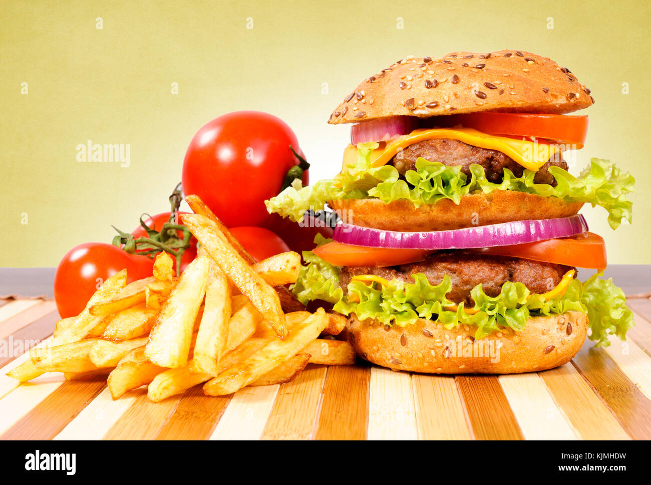 Double cheeseburger on the wooden table Stock Photo - Alamy