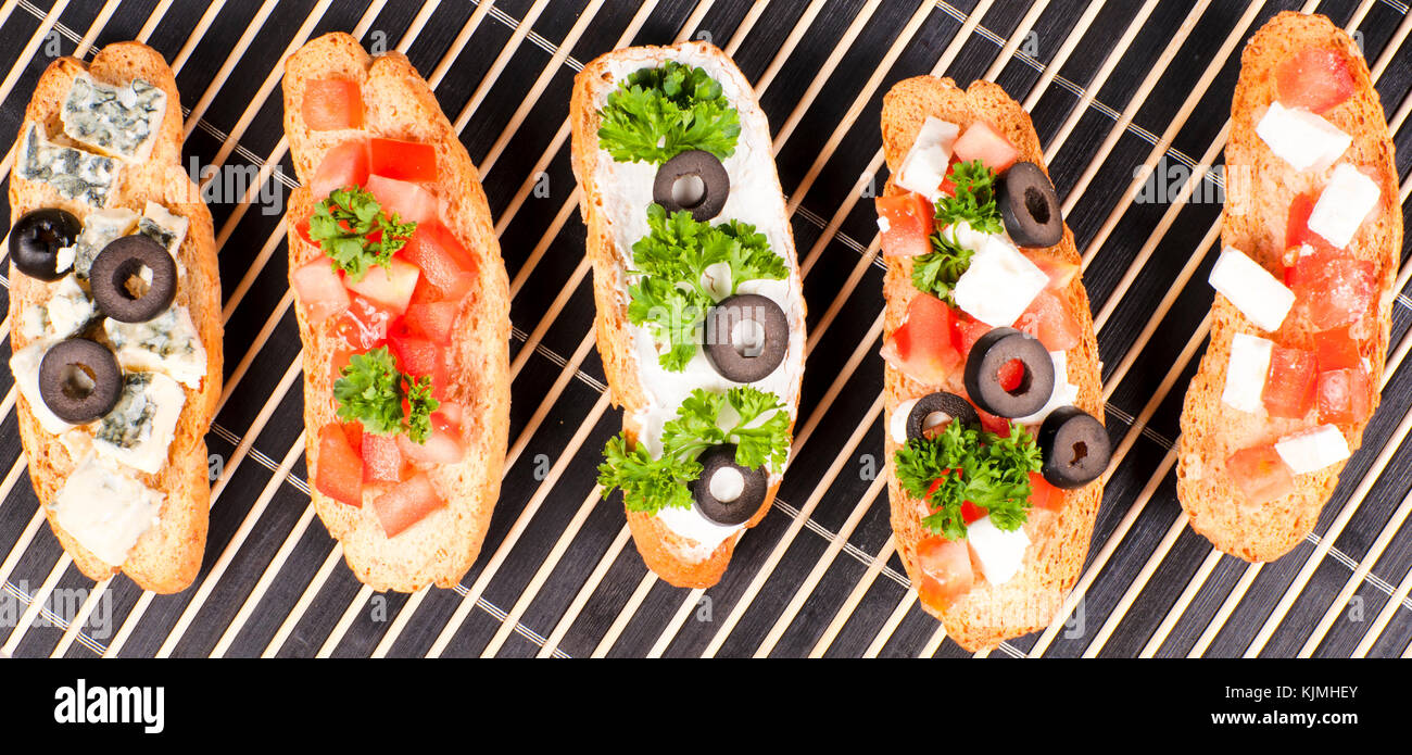 Five fresh bruchettas from above Stock Photo - Alamy