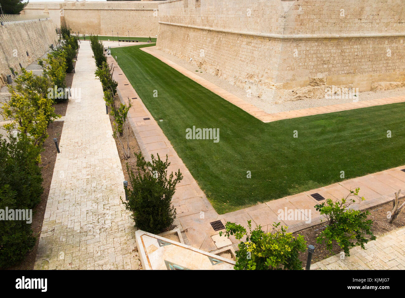 The Mdina Ditch Garden with well cared for perfect lawn grass and which ...