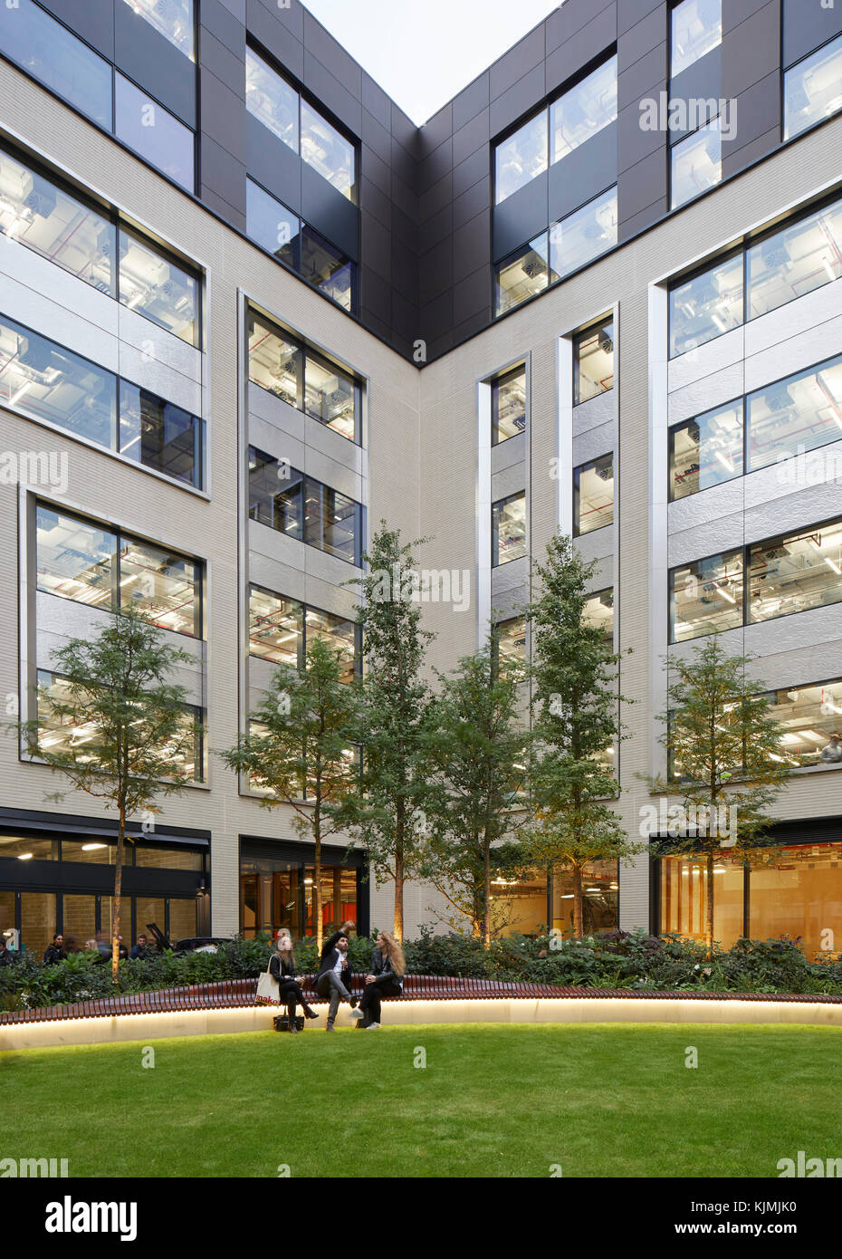 View of central courtyard with group of people attending opening event ...