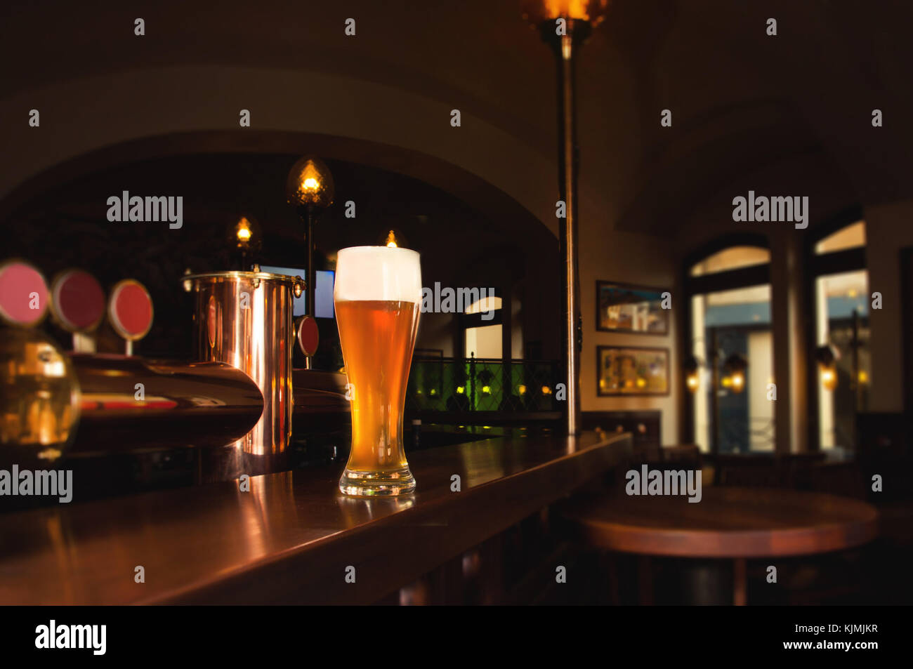 Glass of lager beer on bar of restaurant Stock Photo - Alamy