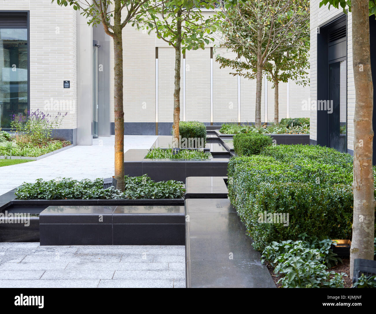 Planters in courtyard. Rathbone Square, London, United Kingdom ...