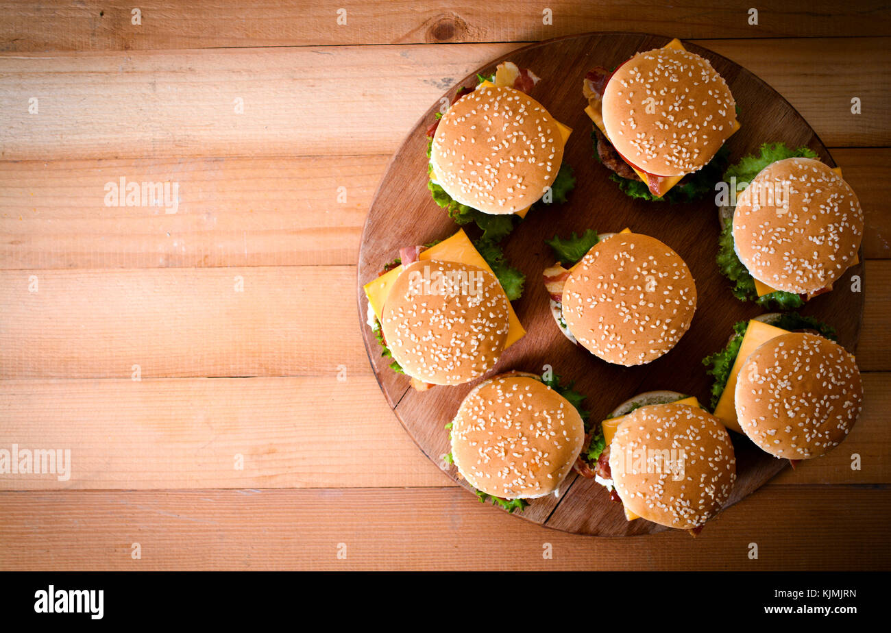 Group of beef burgers on the wooden background,from above and selective ...