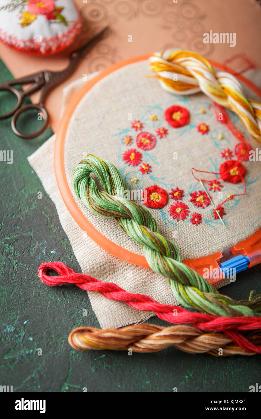Set with embroidery in the process, the embroidery frame, linen cloth ...