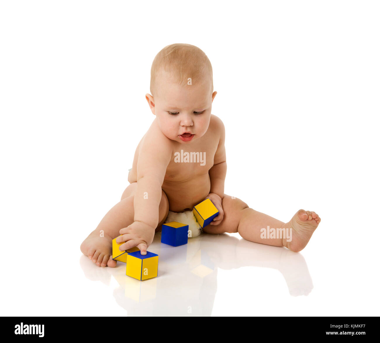Curious baby playing looking up isolated on white Stock Photo - Alamy