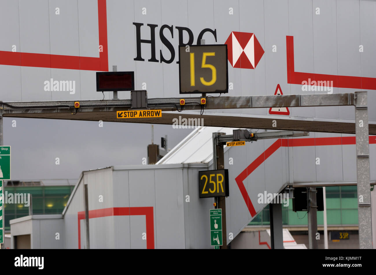 airport apron signs for gate 15 with gate 25R behind and HSBC ...