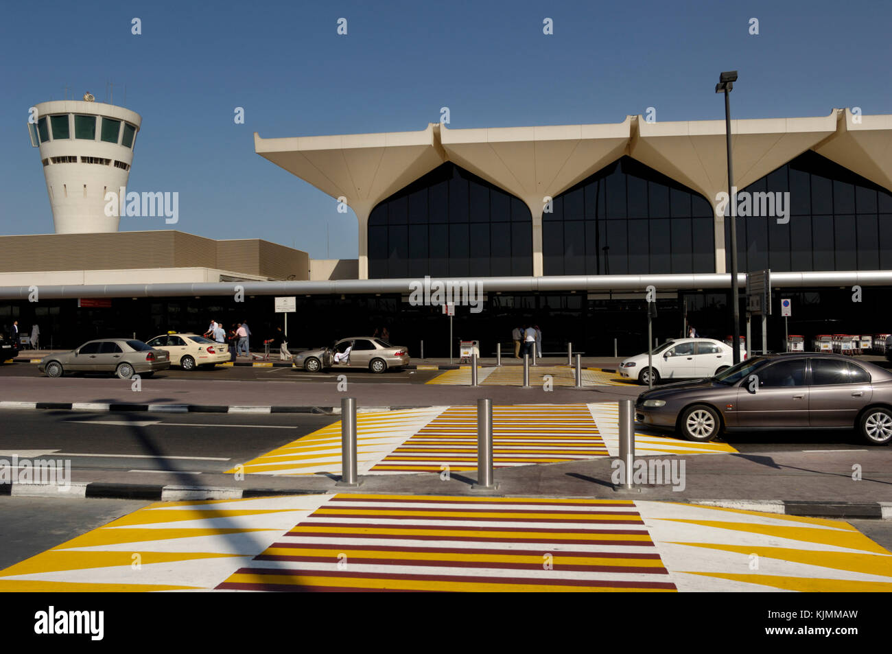 multi-coloured pedestrian-crossing outside Terminal1 with control-tower ...