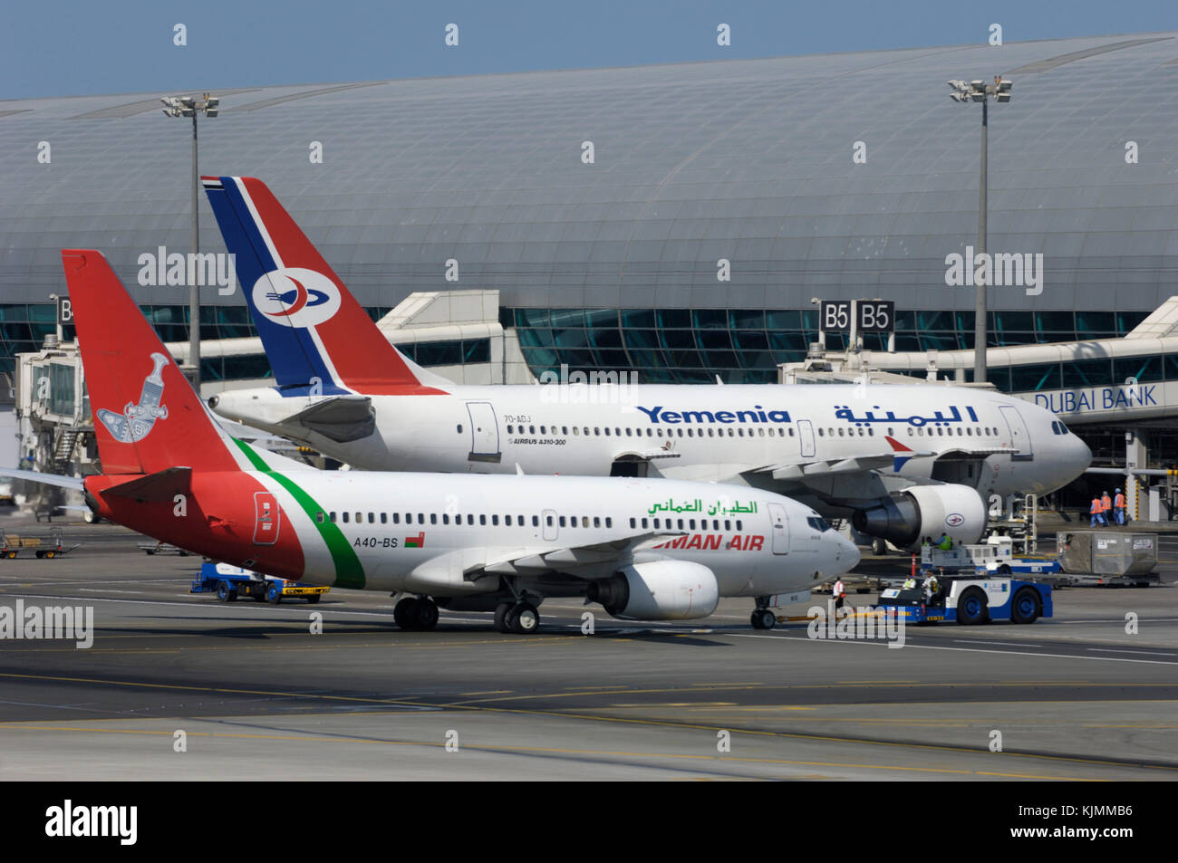 Oman Air 737 pushback from gate by a tug with Yemenia A310-324 7O-ADJ ...