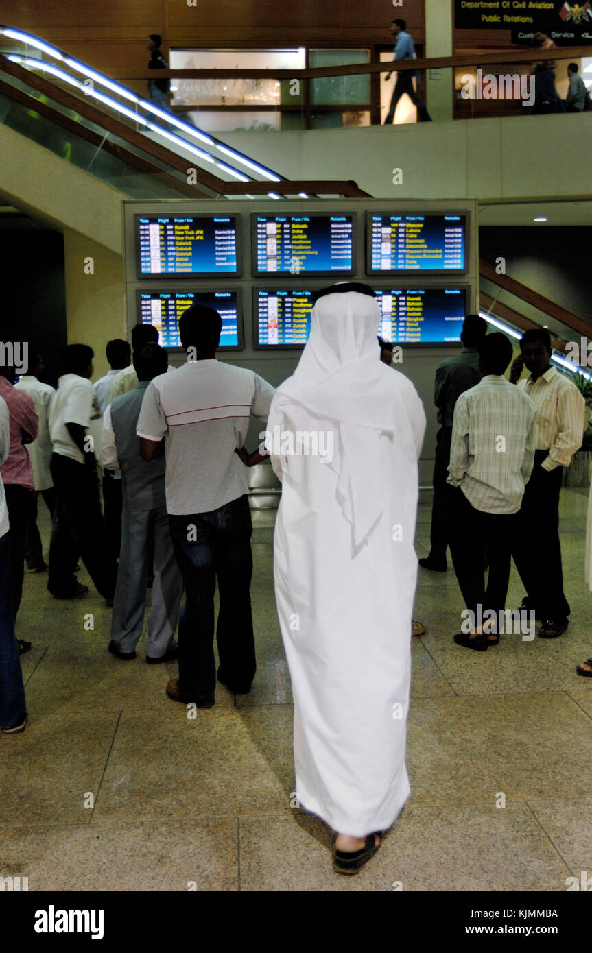 men greeters and friends waiting in the Terminal1 arrivals concourse ...