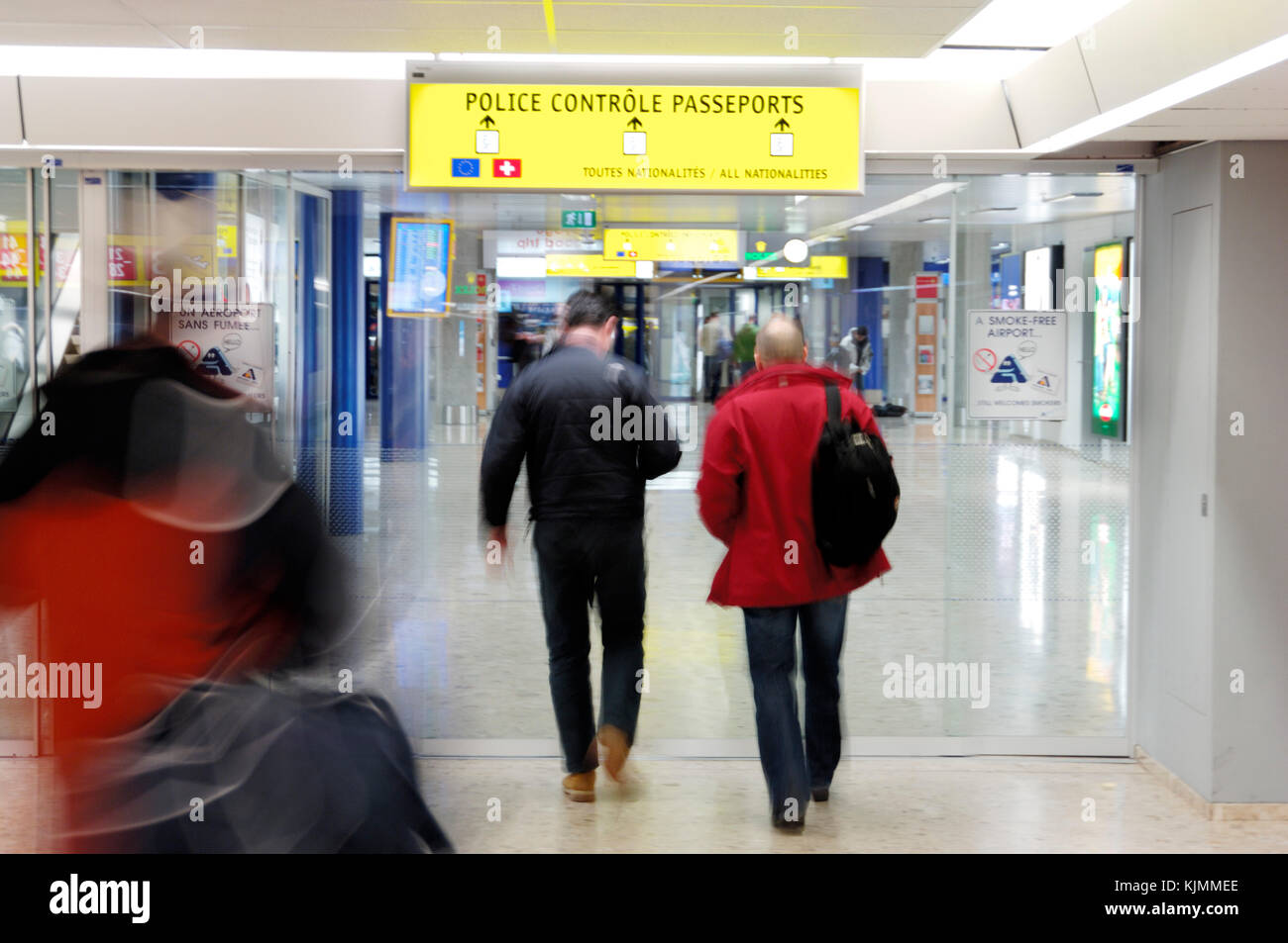 passengers passing under immigration passport control signs Stock Photo ...