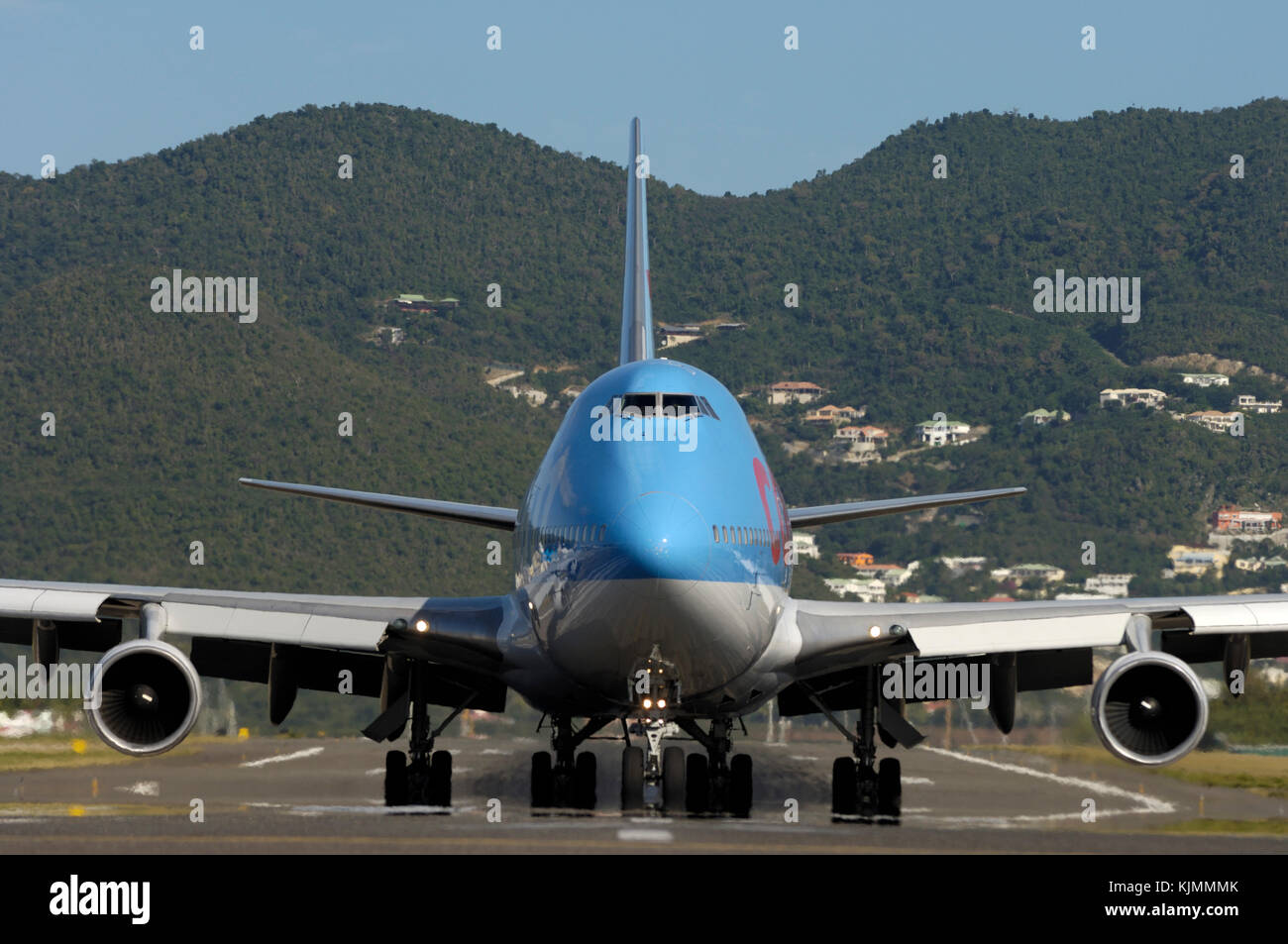 B747 on the runway with hills behind B747 on the runway with hills ...